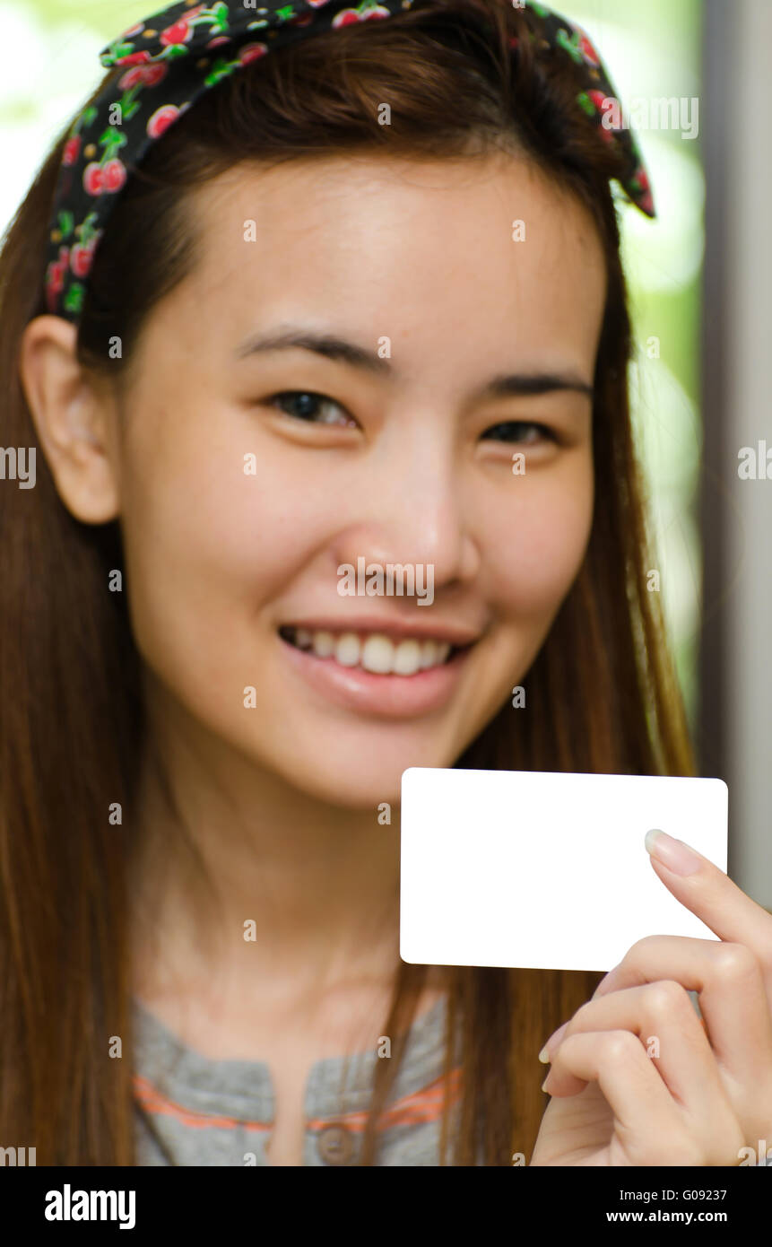 Cute girl holding credit card Stock Photo - Alamy