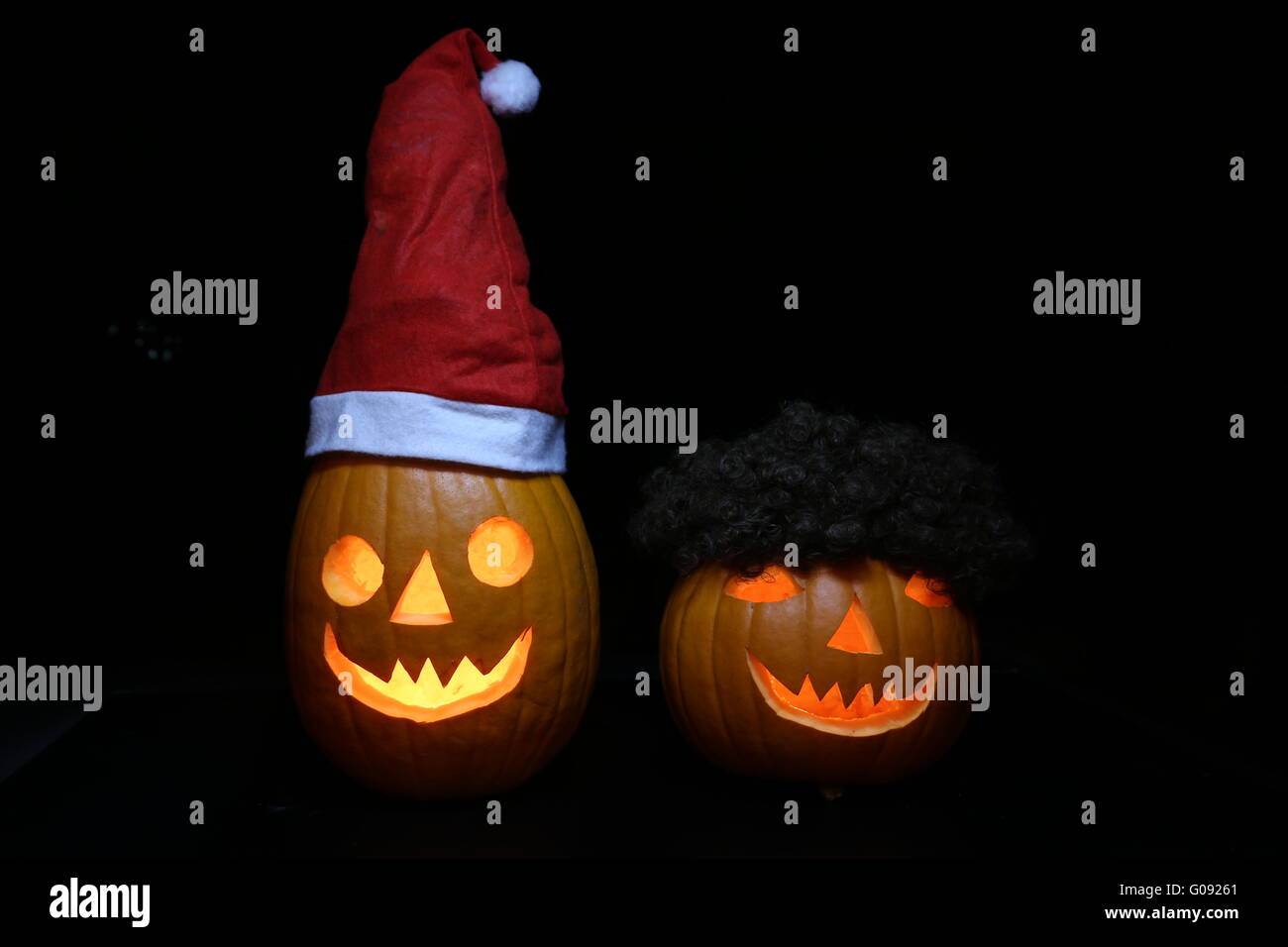 Helloween pumpkin couple santa Claus Stock Photo - Alamy