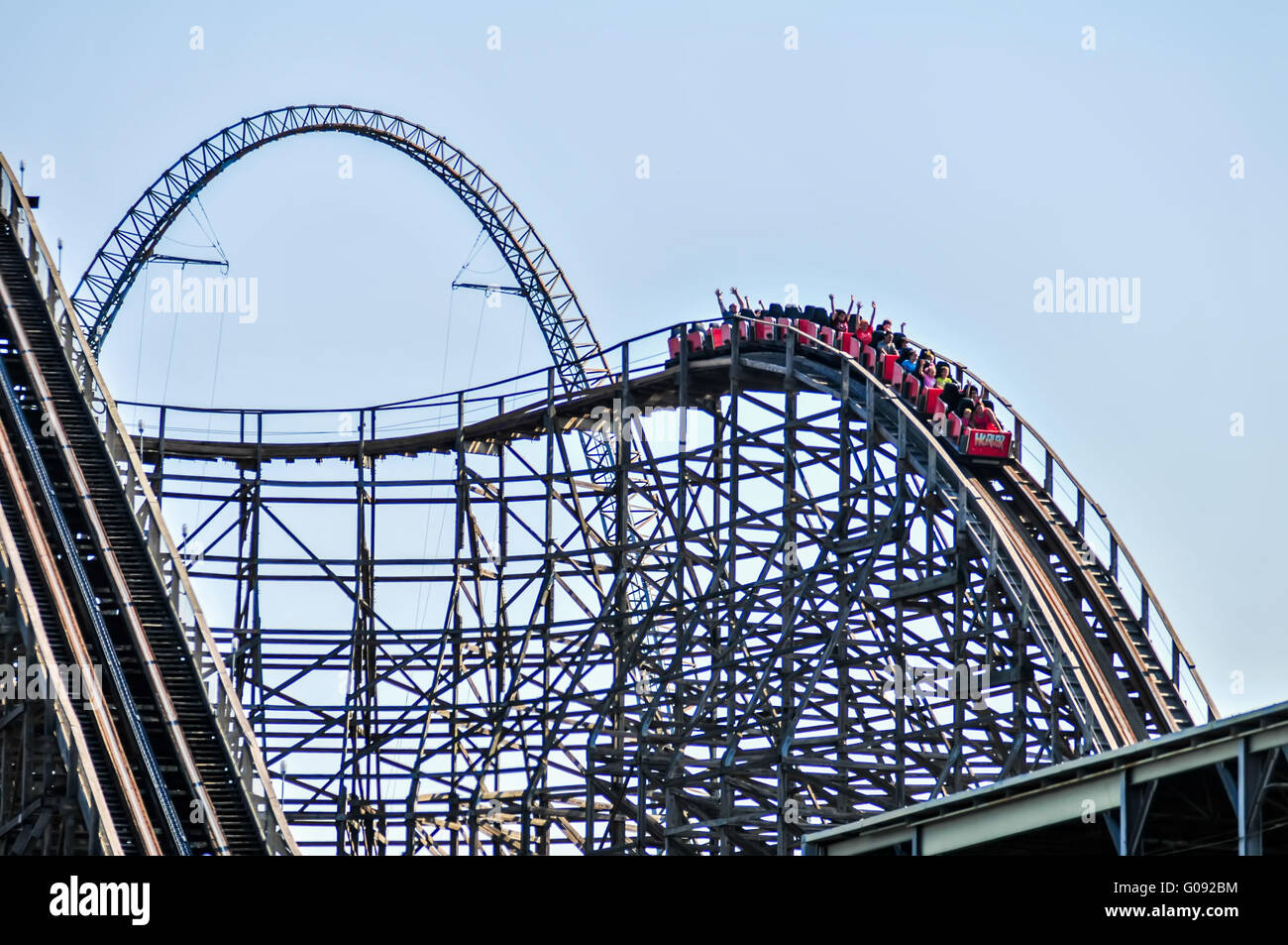 rollercoasters at an amusement park with blue sky Stock Photo - Alamy