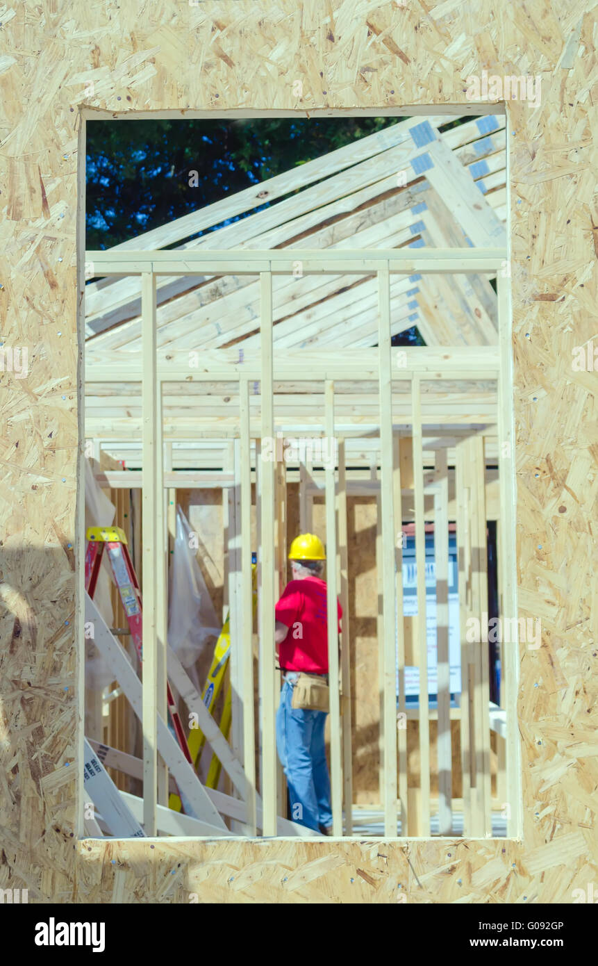 wood frame construction job seen trhough window opening Stock Photo - Alamy