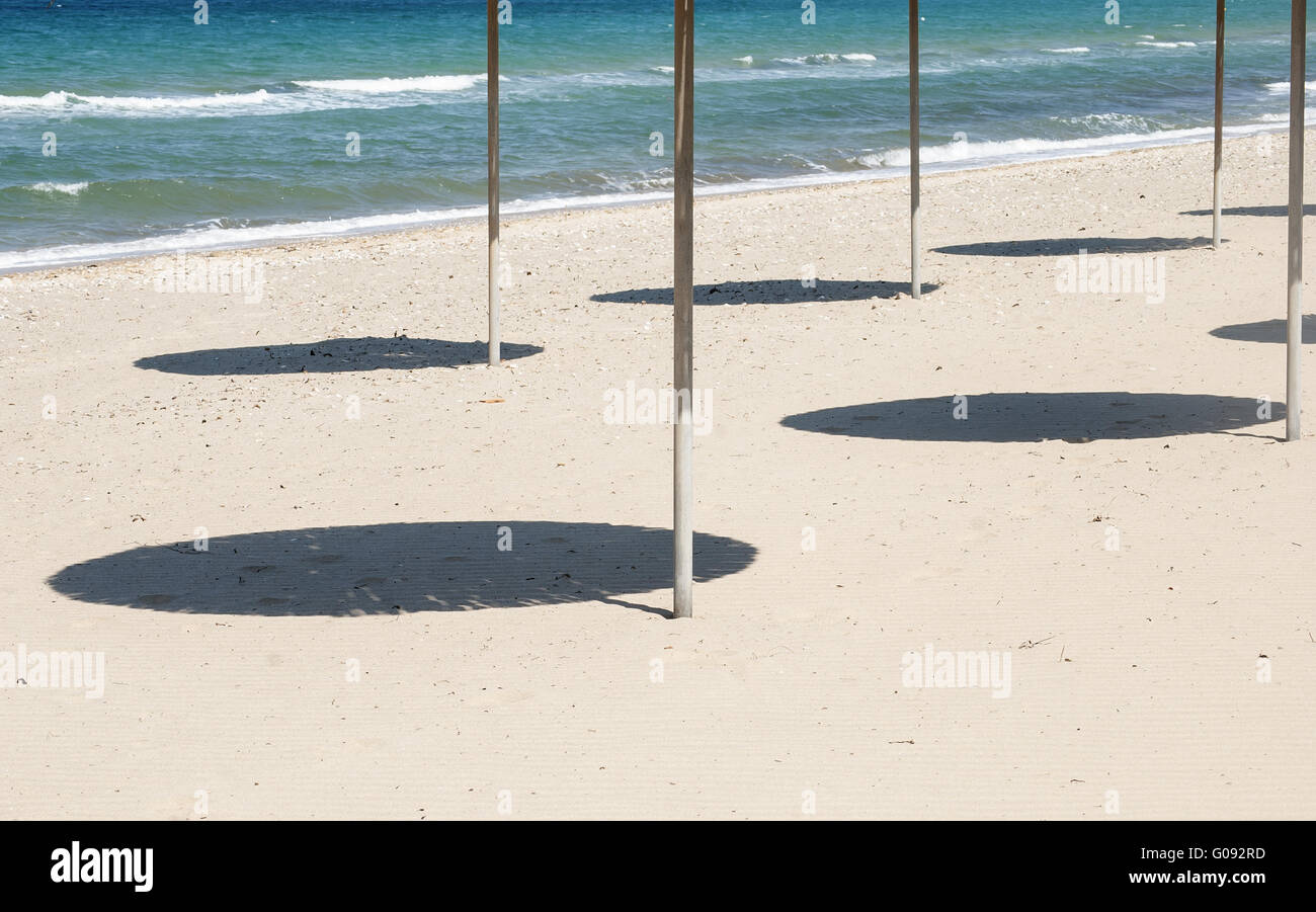 Shades of parasols on sea beach in sunny day Stock Photo - Alamy