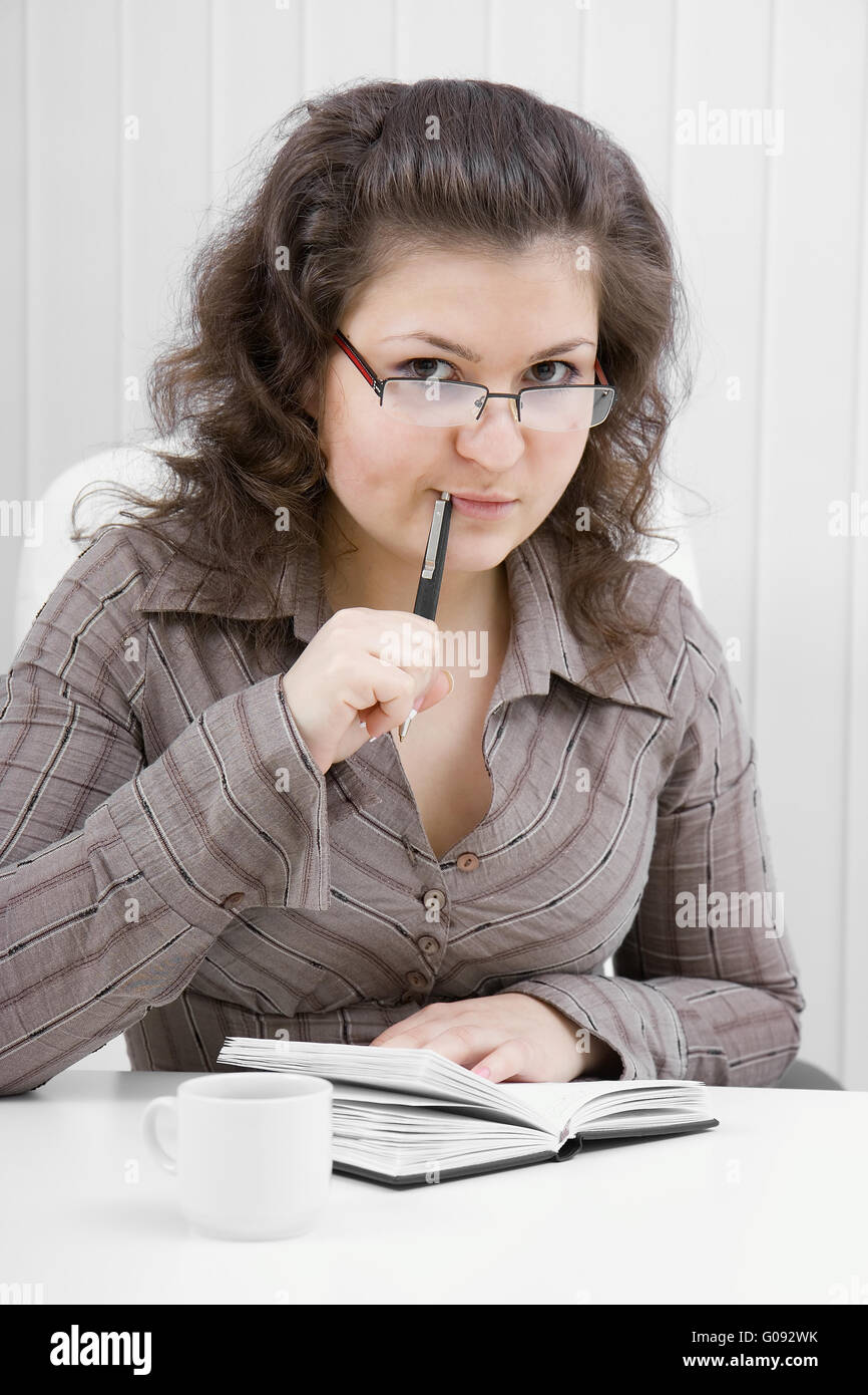 The puzzled girl with notebook and the handle Stock Photo - Alamy