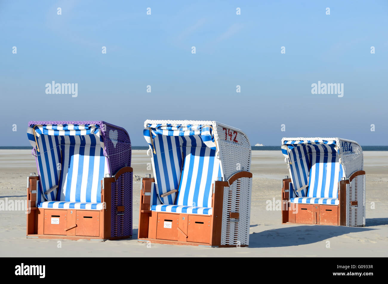 Three beach chairs Stock Photo - Alamy