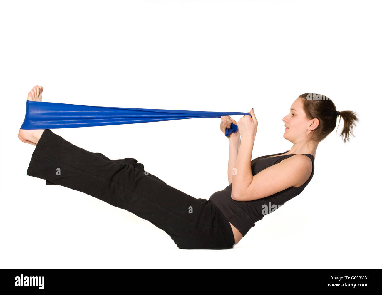 Woman is stretching her legs with a Resistance Band Stock Photo - Alamy