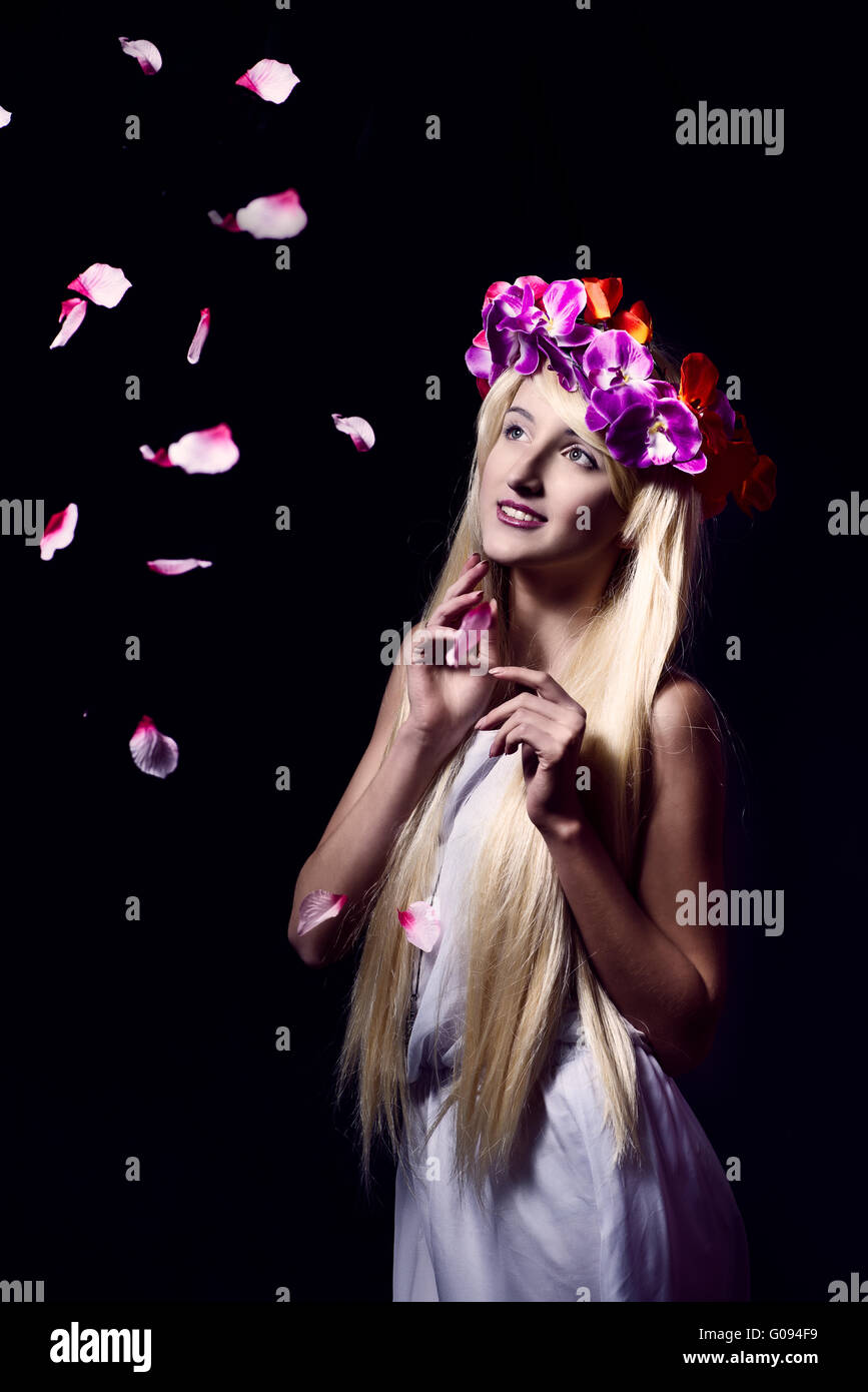 The beautiful girl with a fair hair with a wreath Stock Photo - Alamy