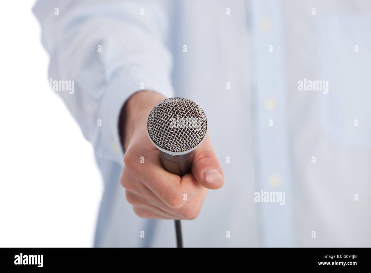 Man holding a retro microphone towards the camera Stock Photo - Alamy