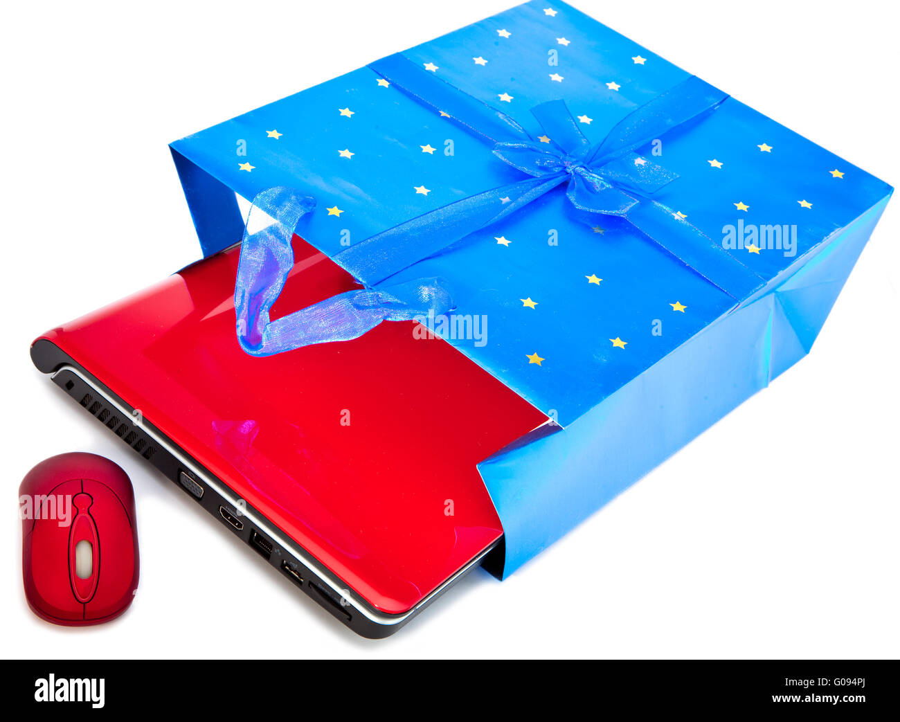 Red laptop and a computer mouse are packed into a Stock Photo - Alamy