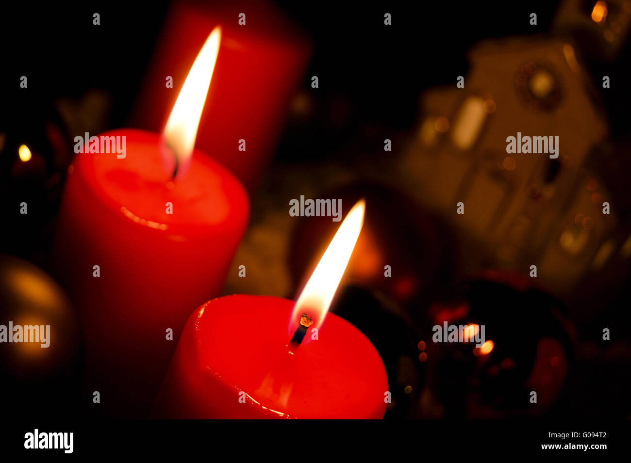 Lighted red candles Stock Photo - Alamy