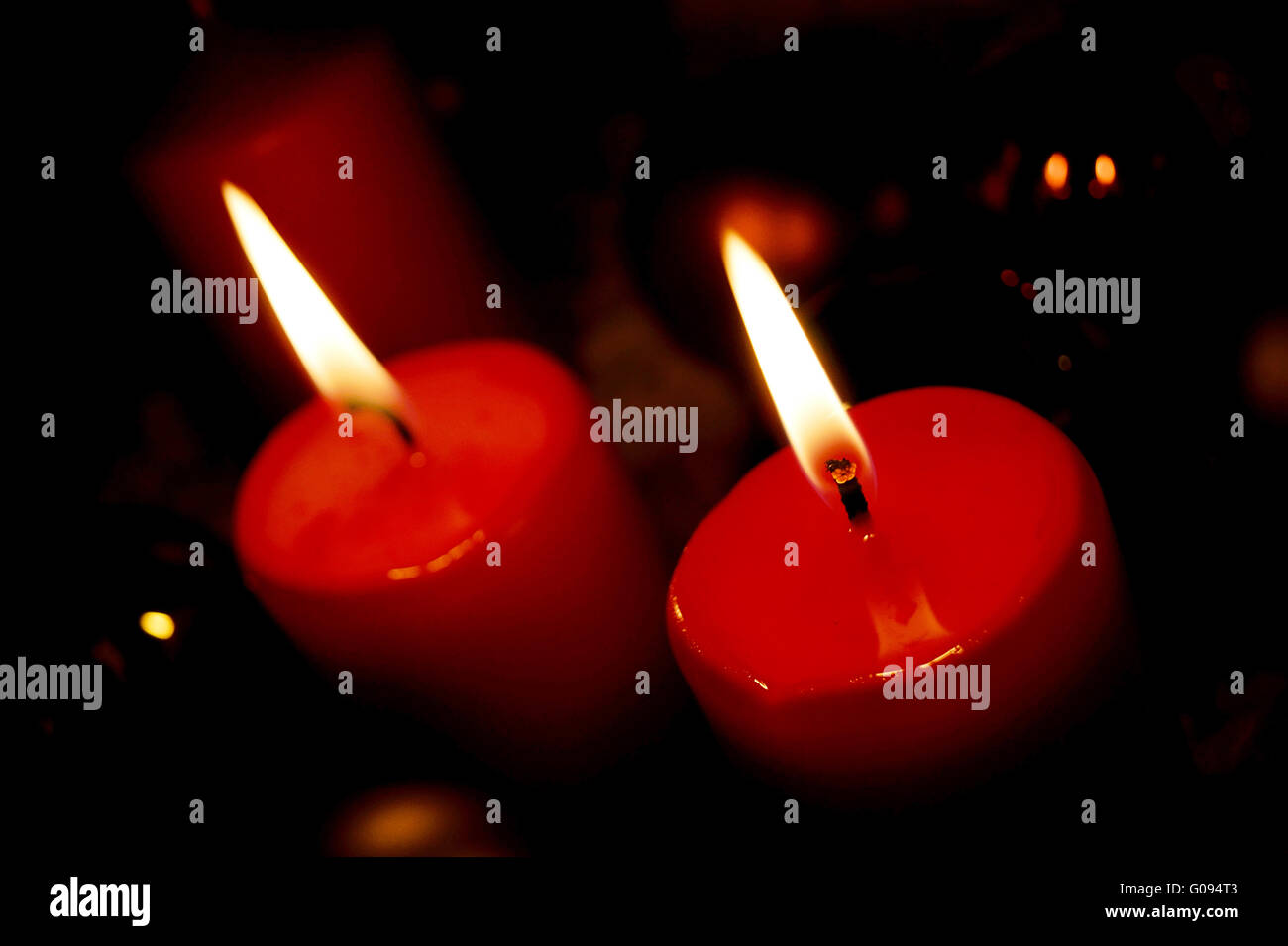 Lighted red candles Stock Photo - Alamy