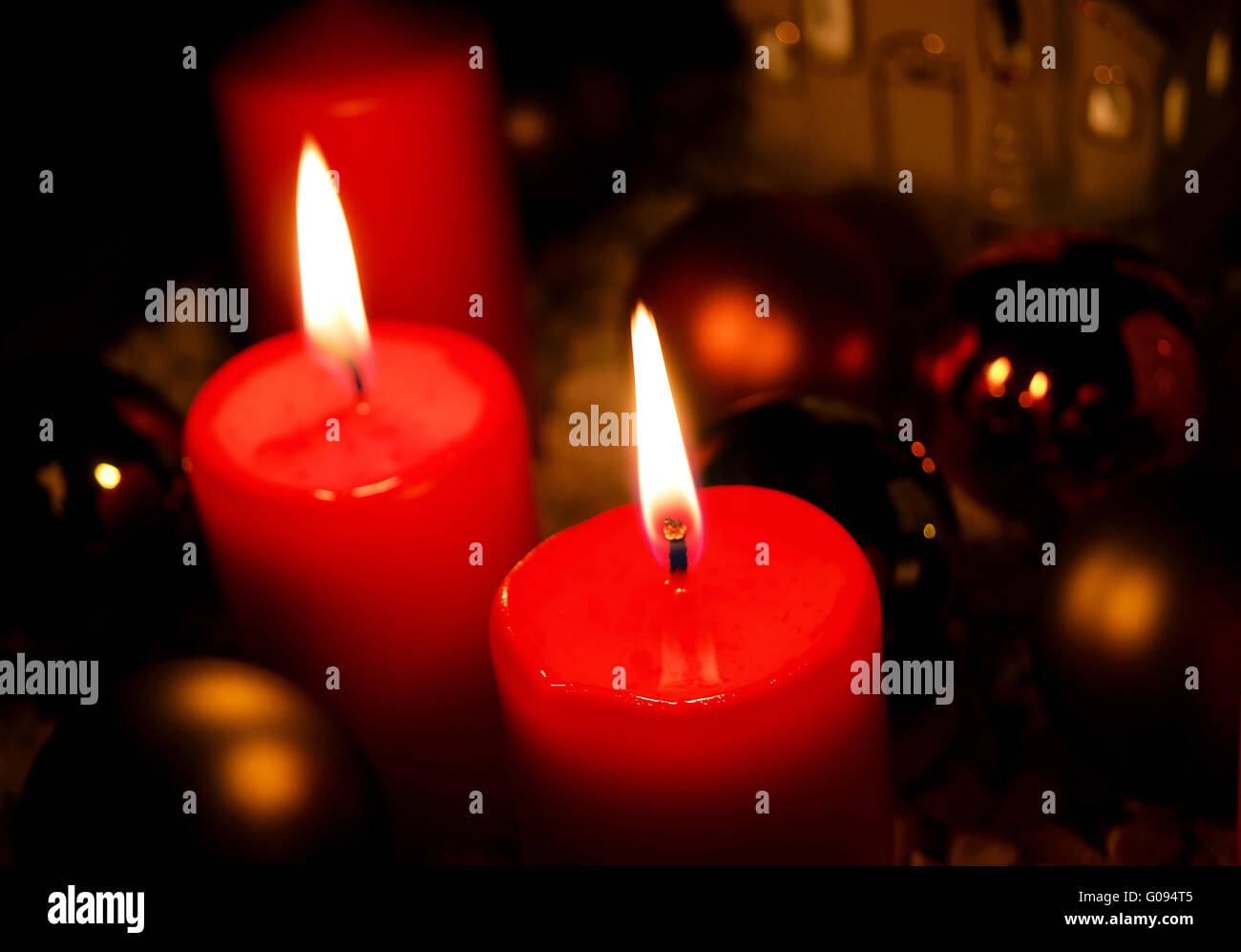 Lighted red candles Stock Photo - Alamy