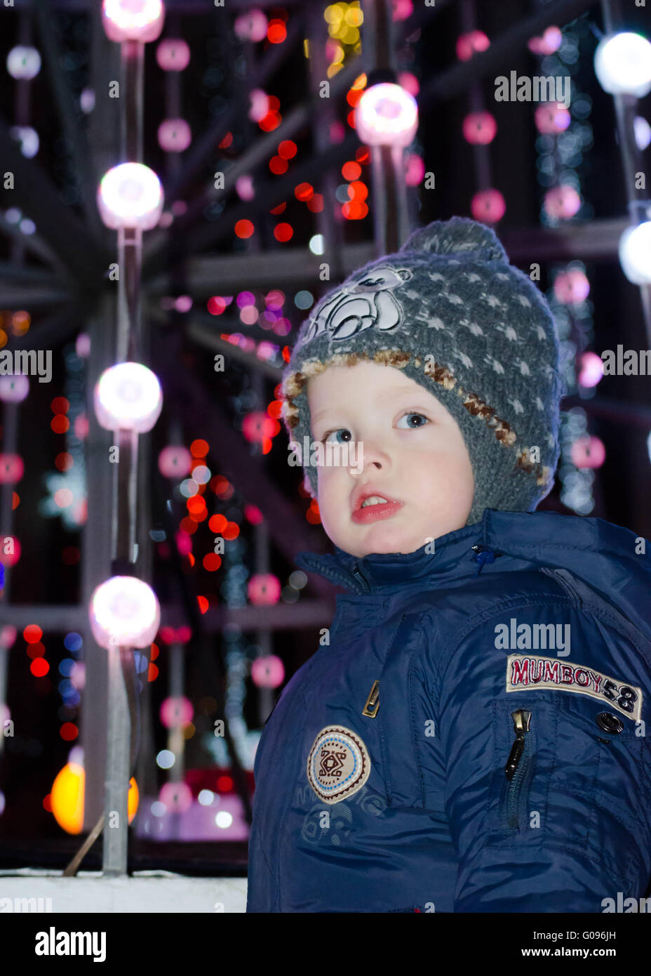 Smart boy dressed in a winter hat and jacket Stock Photo - Alamy