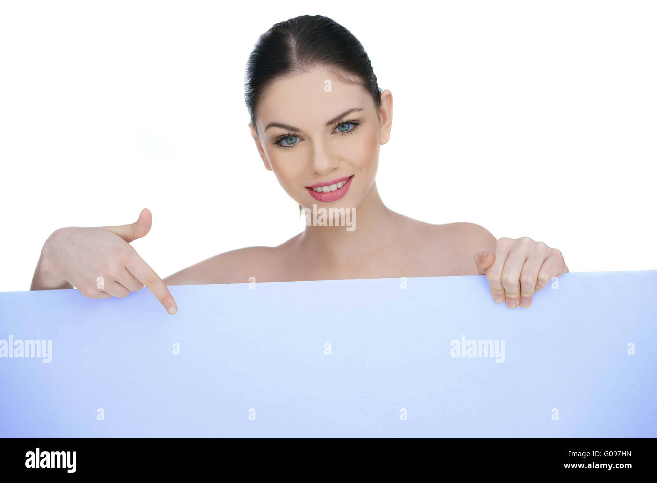 Beautiful woman pointing to a blank sign Stock Photo - Alamy