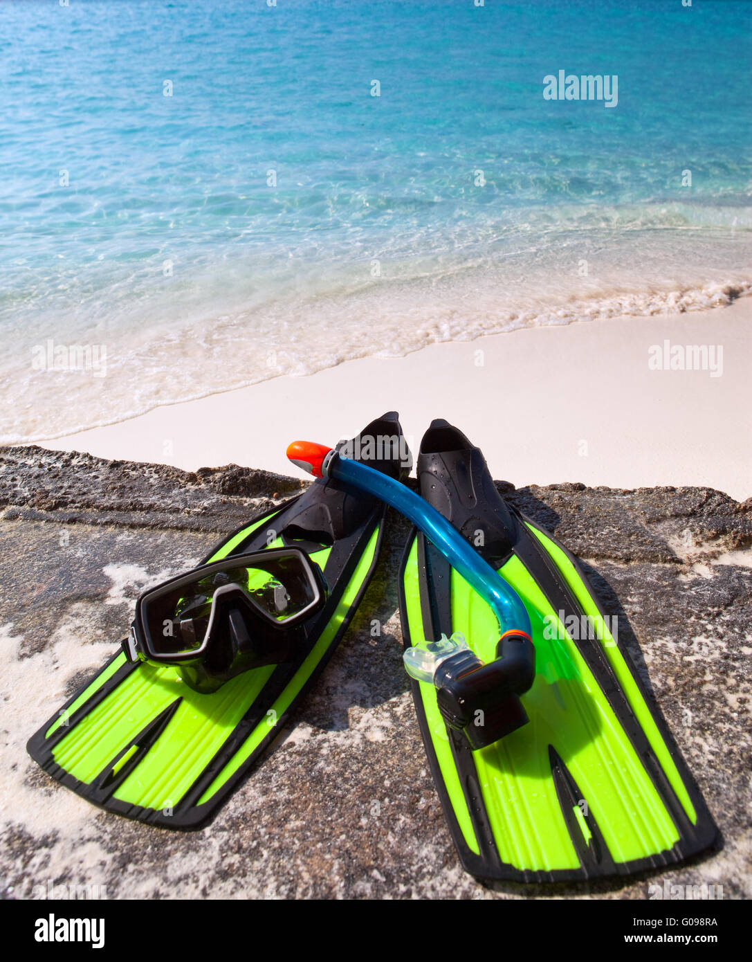 mask, flippers, tube-lay on sand on background of Stock Photo - Alamy