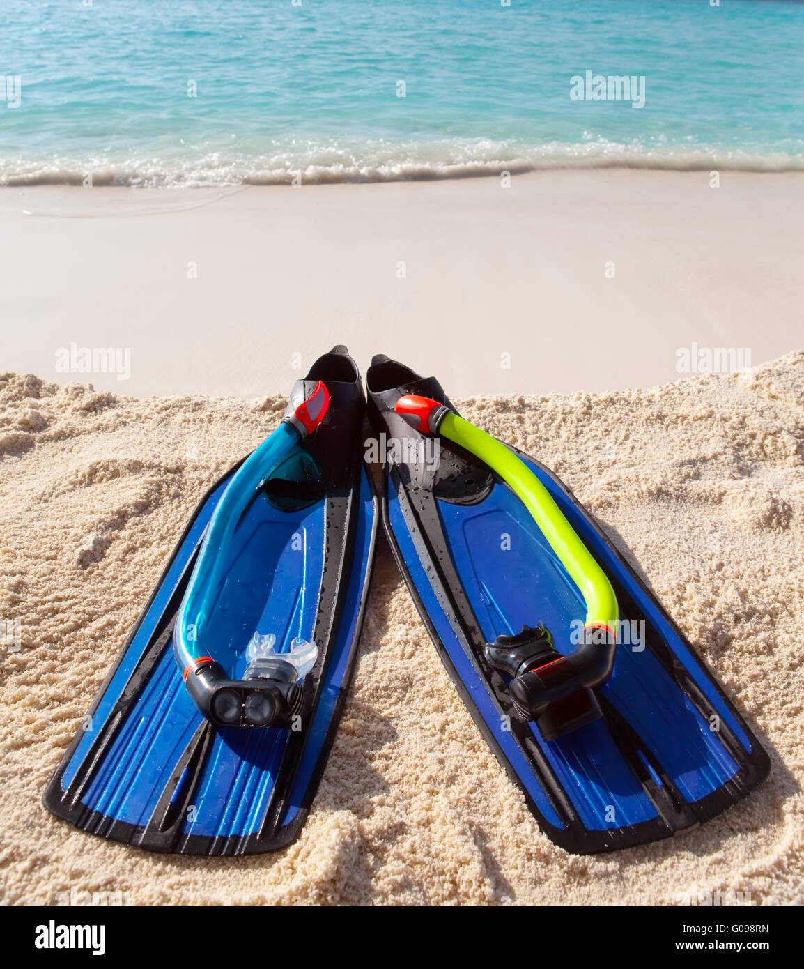 flippers, tube-lay on sand on background of ocean Stock Photo - Alamy