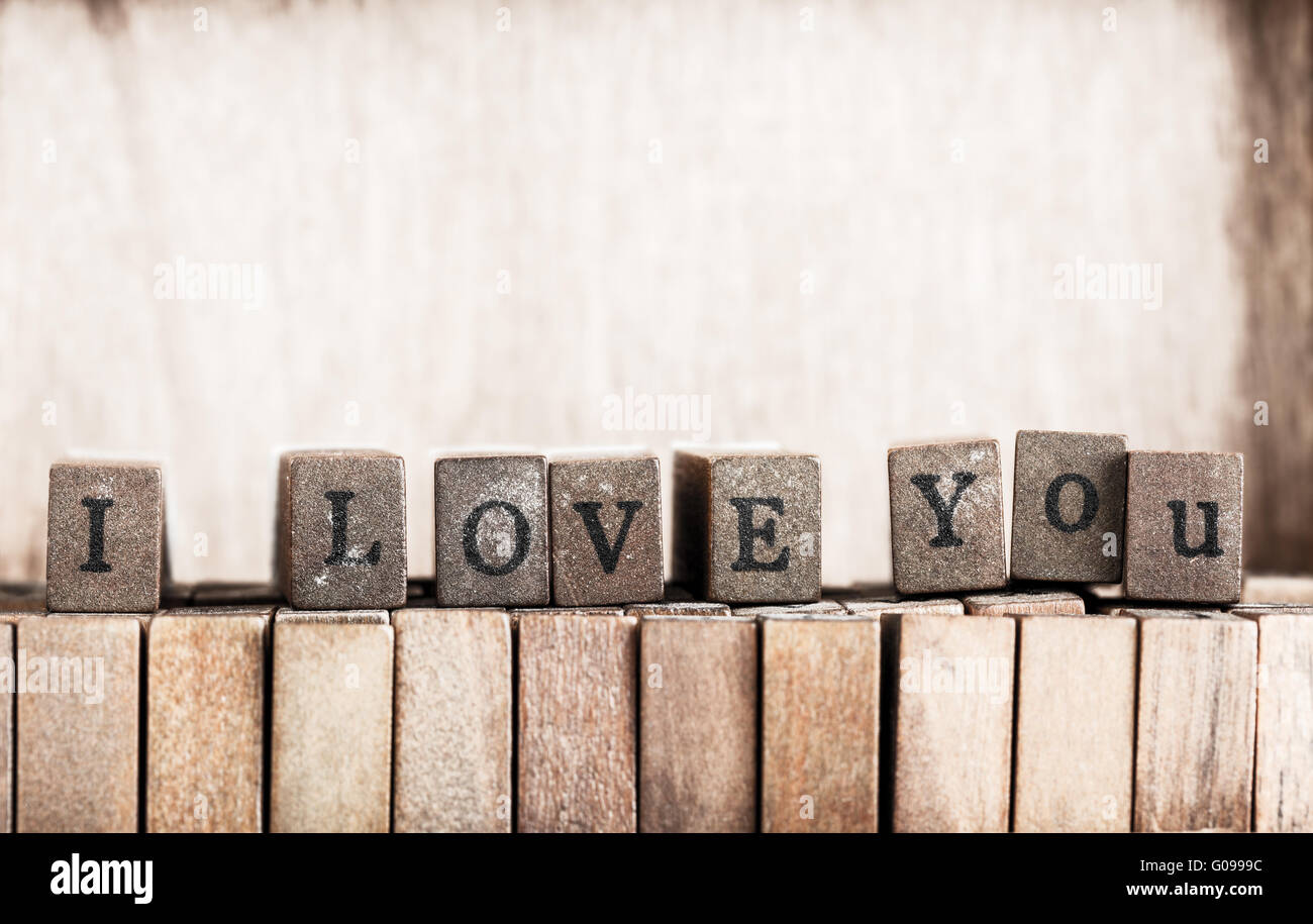 Wood cube make message i love you Stock Photo - Alamy