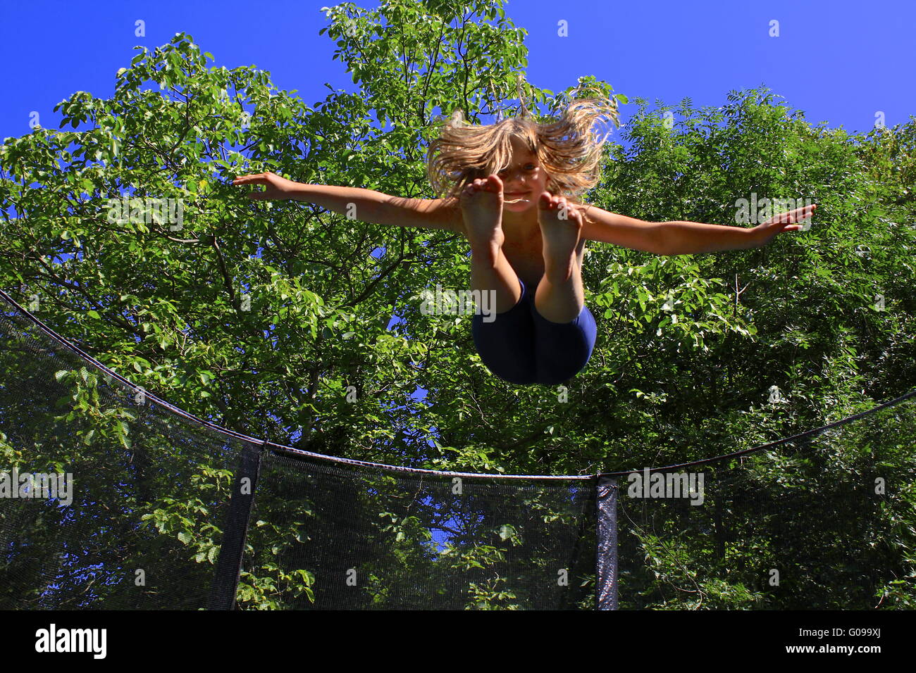 Child leaping hi-res stock photography and images - Alamy