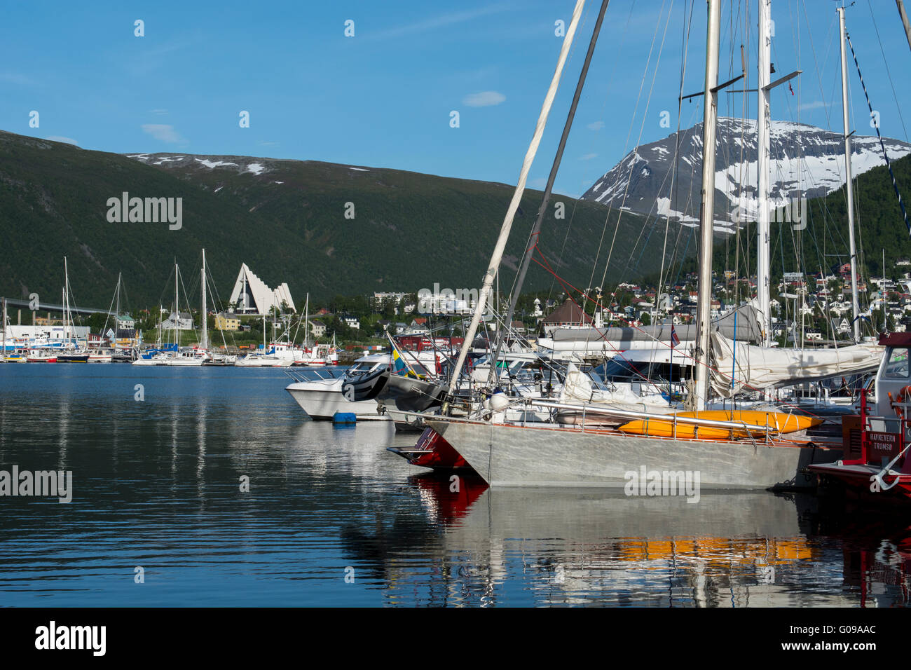 Norway, Tromso. Harbor area and waterfront view of the Arctic Cathedral ...