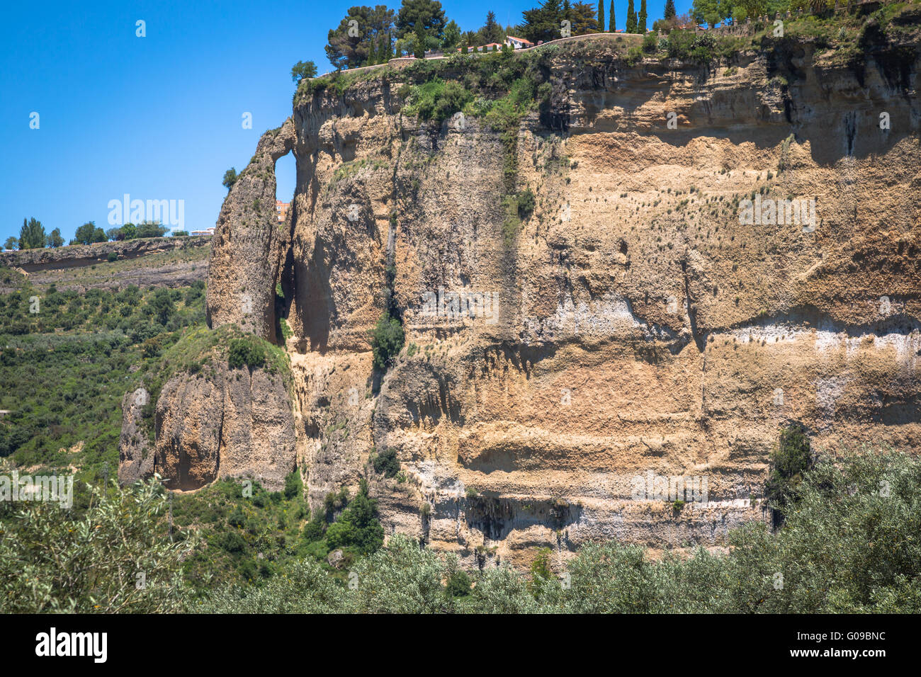 view of buildings over cliff in ronda, spain Stock Photo - Alamy