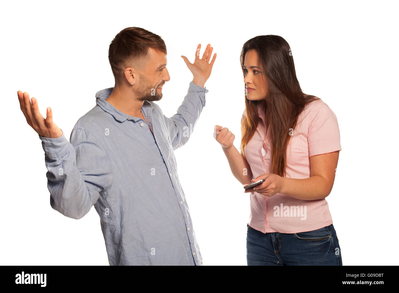 Young couple having an argument with defensive man Stock Photo - Alamy