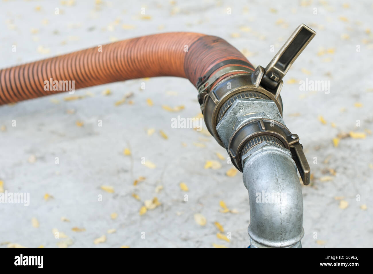 Truck Hoses for fuel station, pumps and oil barrels Stock Photo - Alamy