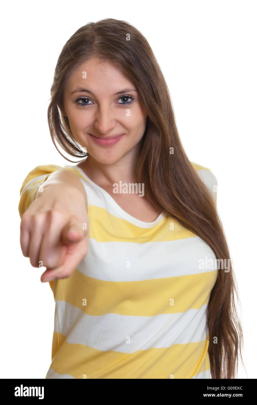 Woman with long brown hair pointing at camera Stock Photo - Alamy