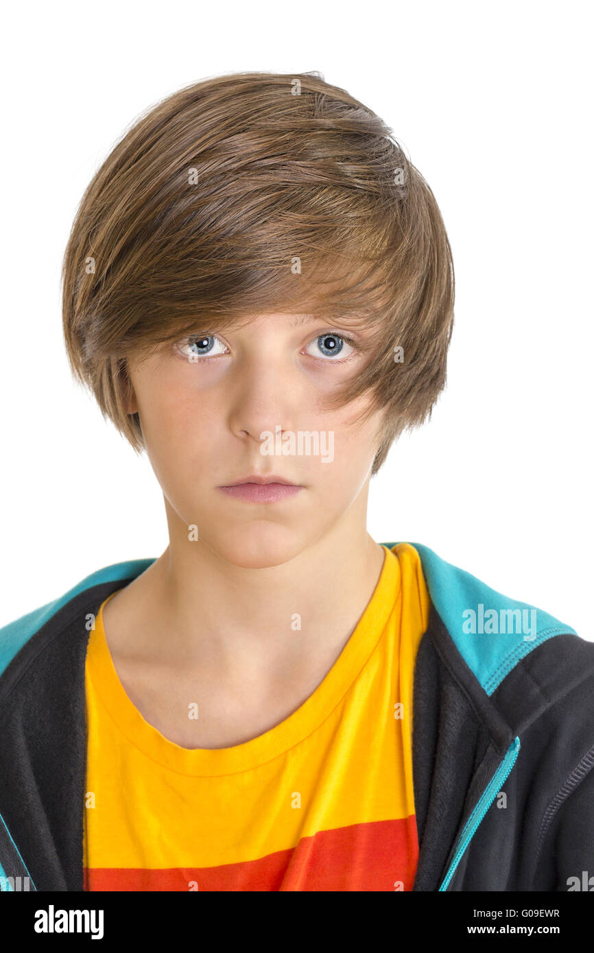 Closeup of a cute teenage boy looking into the camera, isolated on ...