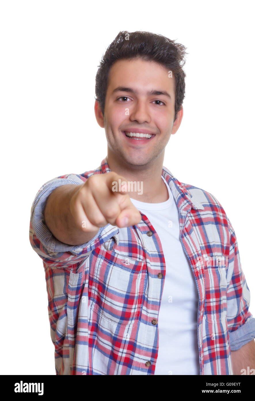 Laughing hispanic guy pointing at camera Stock Photo - Alamy