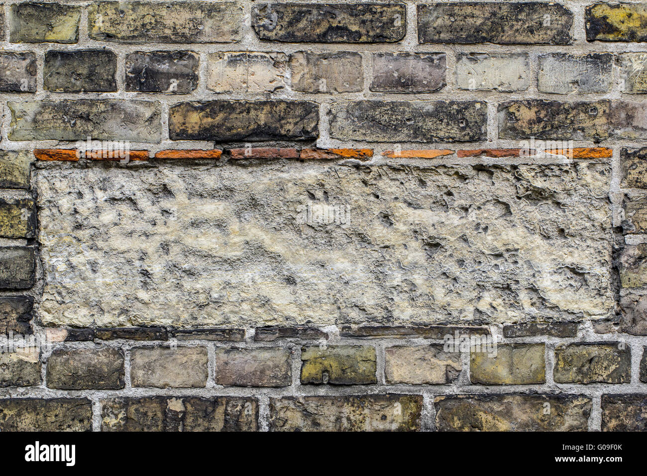 vintage brick wall pattern background with rectangle of cement in the ...