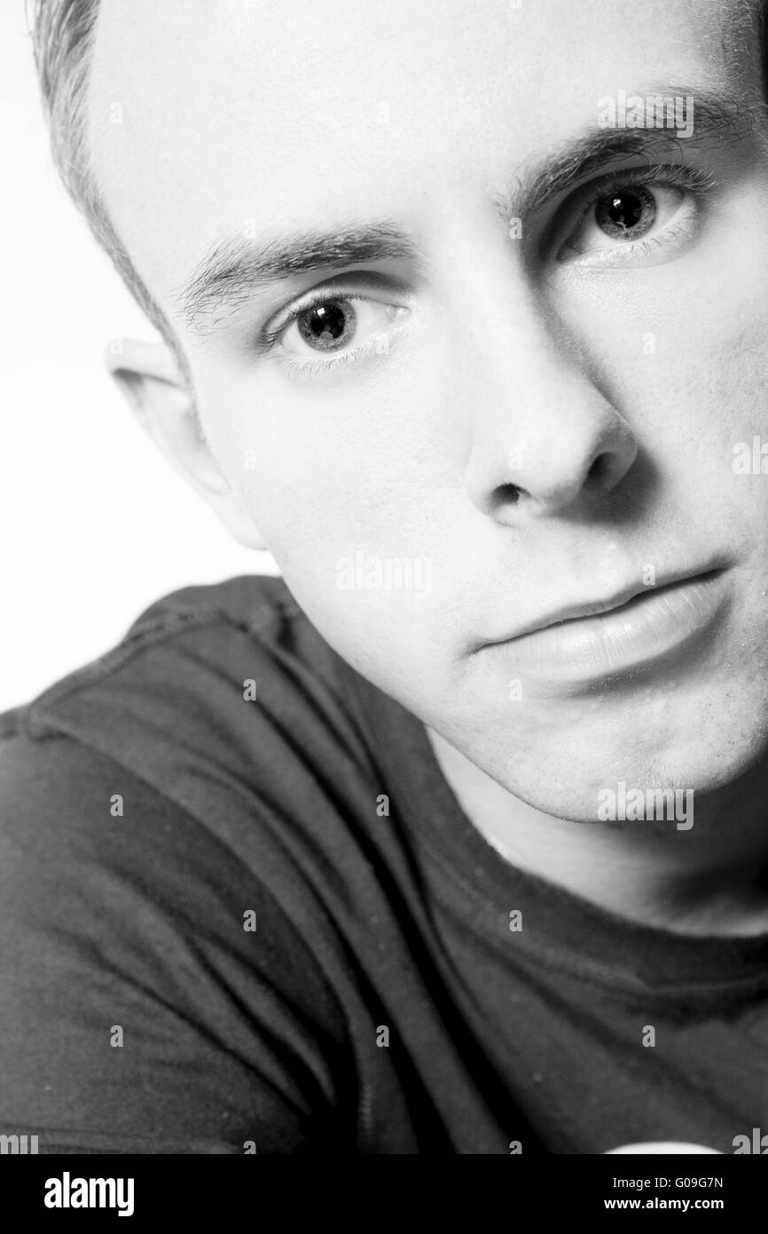 Studio portrait of a young man looking serious Stock Photo - Alamy