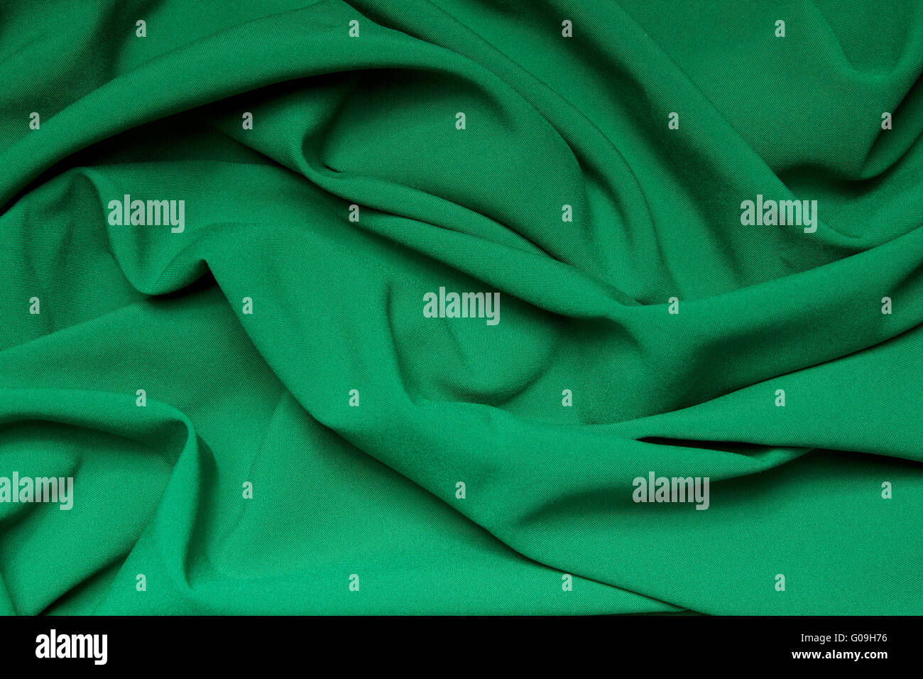 The folds of a bright green cloth. Abstract Background Stock Photo - Alamy