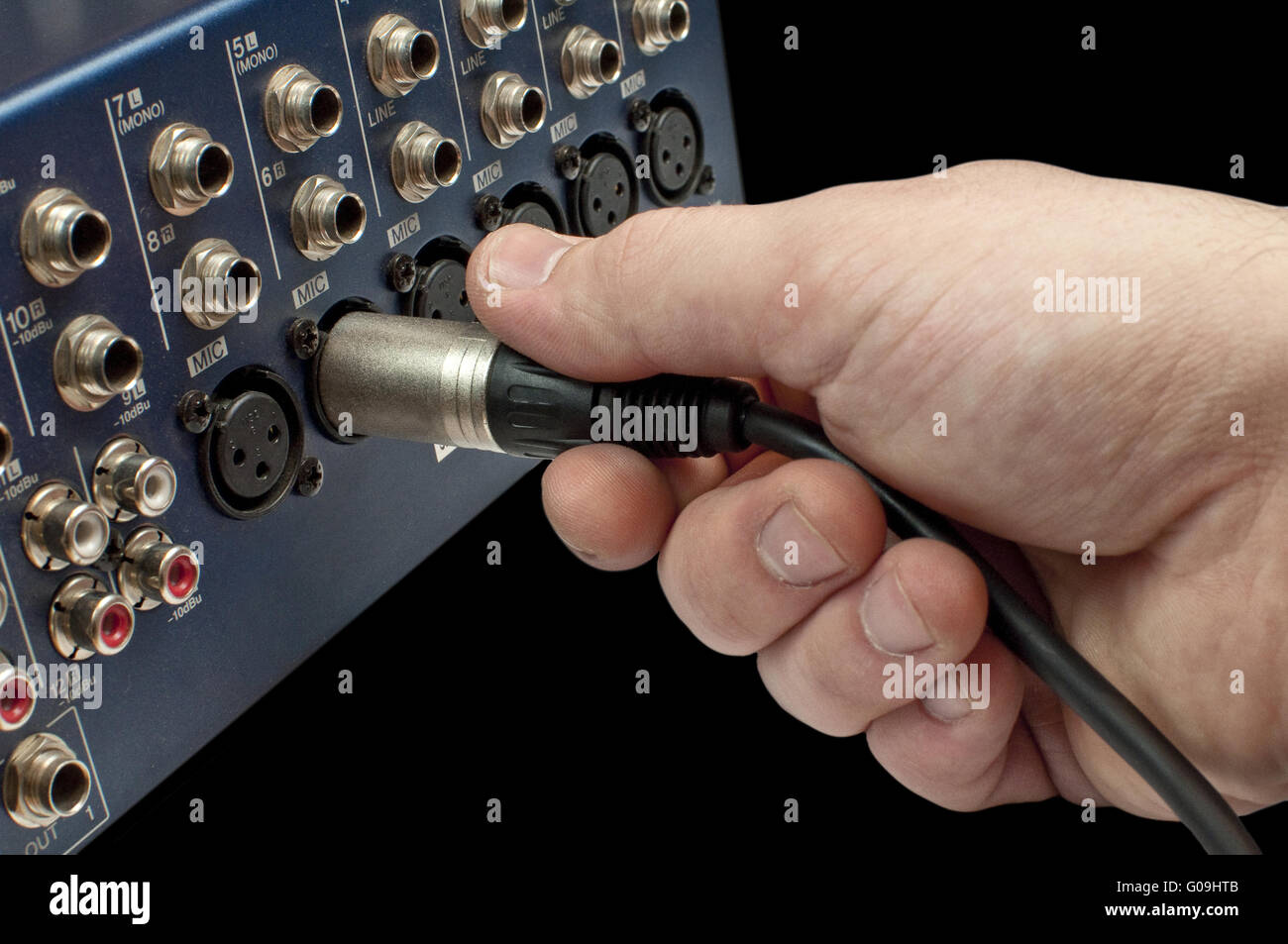 Pluging in a cable Stock Photo - Alamy