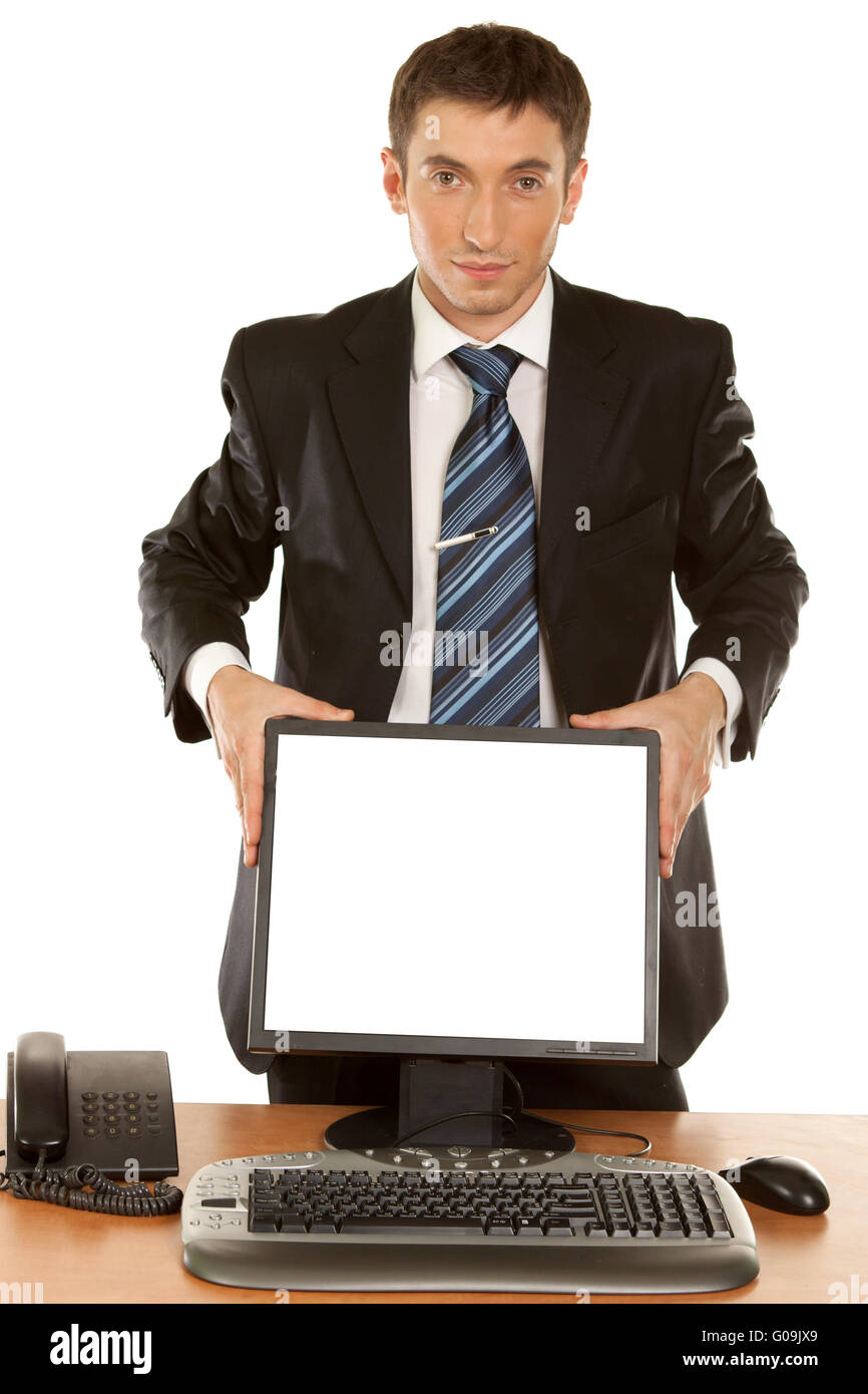 Office worker holding blank computer monitor with clipping path for the ...