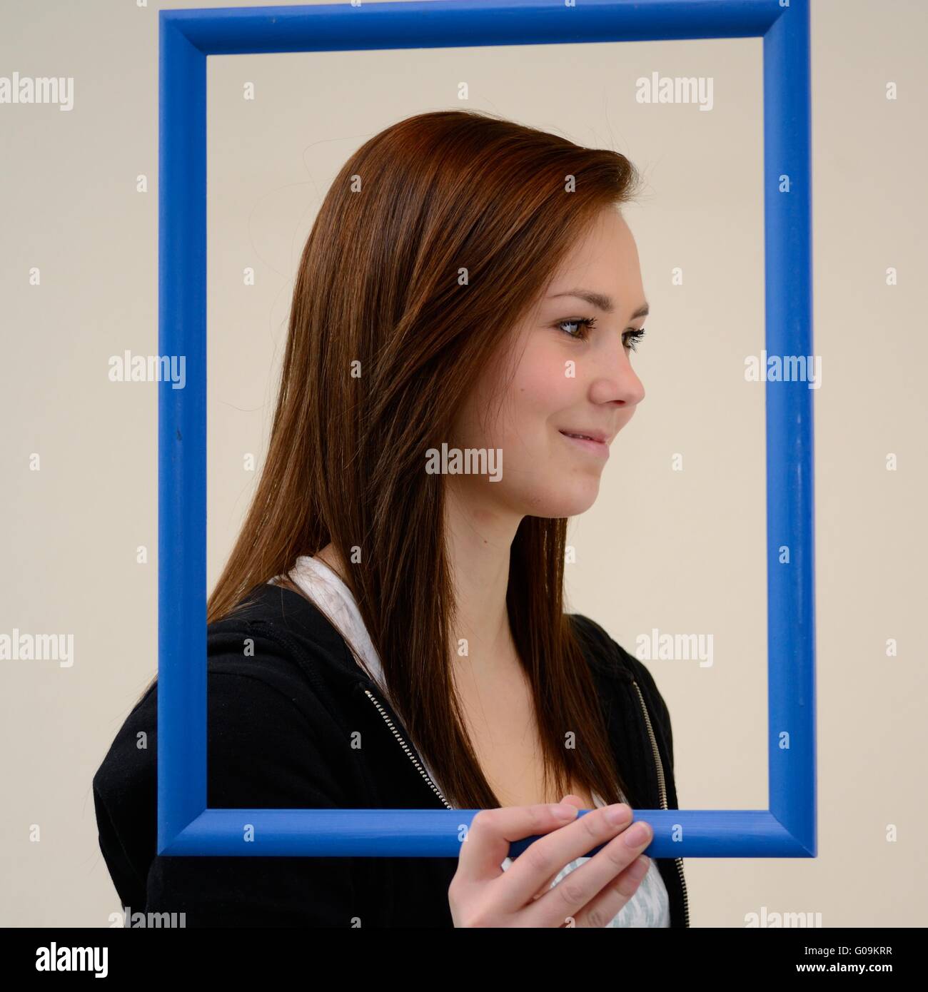 Profile of a teenage girl in the picture frame Stock Photo - Alamy