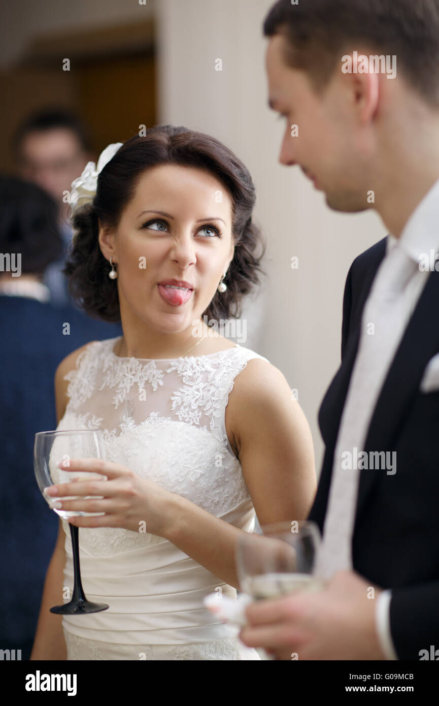 Bride and groom enjoy a drink at the wedding Stock Photo - Alamy