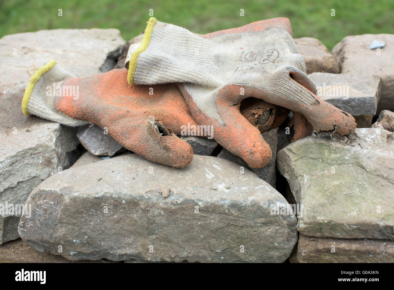 Worn out gloves Stock Photo - Alamy