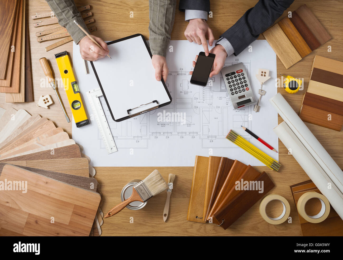 Business people working together on a building project, desktop top ...