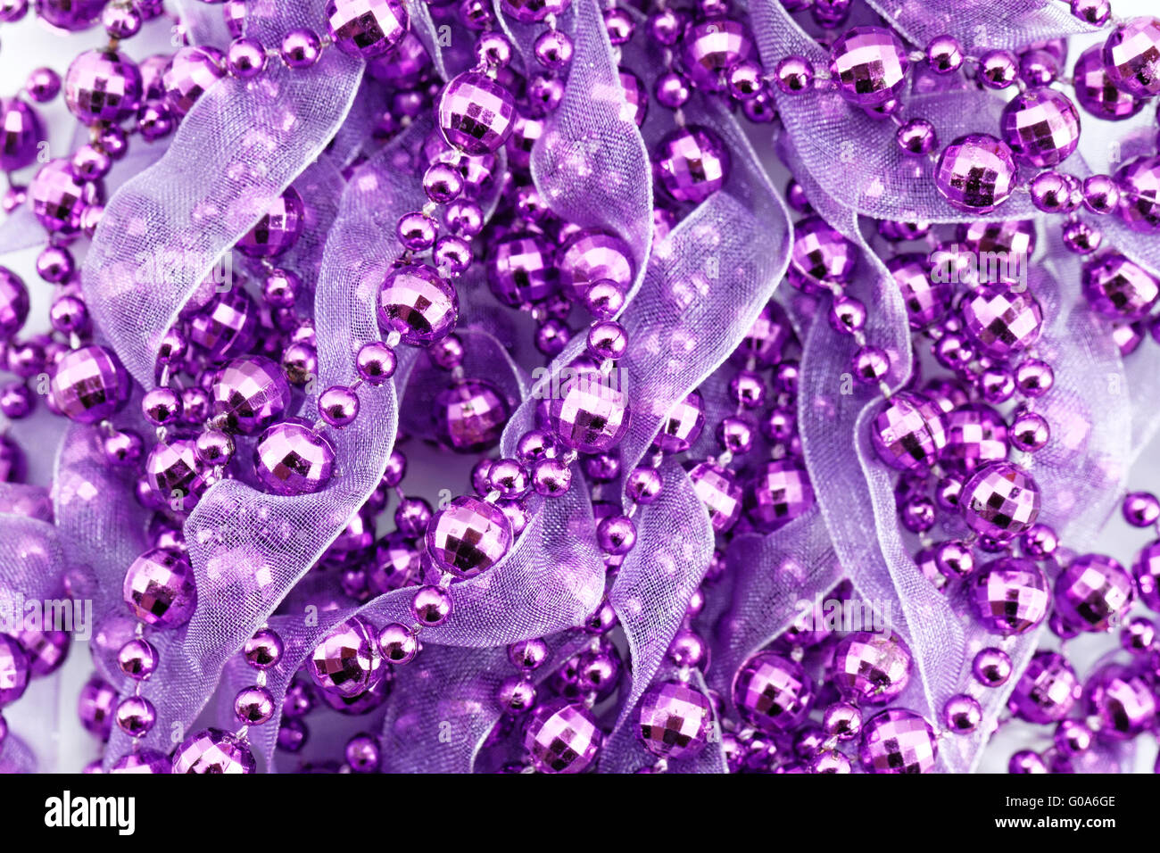 Close up of purple garland. Whole background Stock Photo - Alamy