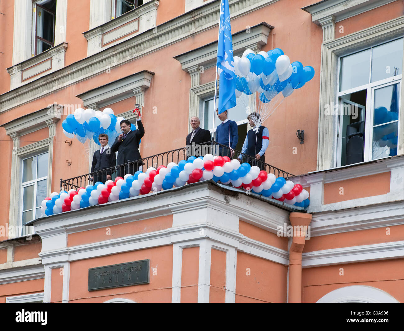 The director rings a hand bell, opening academic y Stock Photo - Alamy