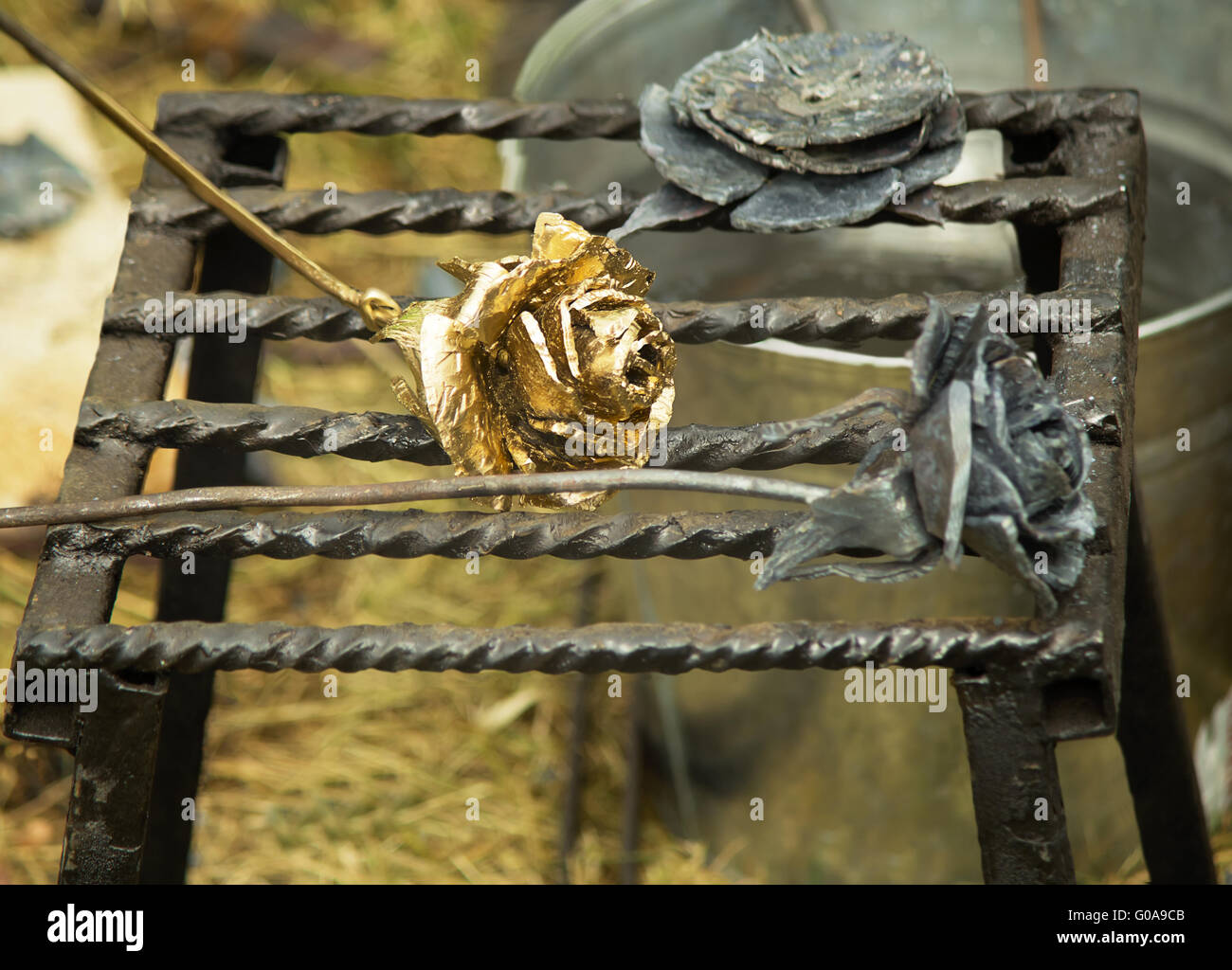 The shiny metal forged roses, handmade Stock Photo - Alamy