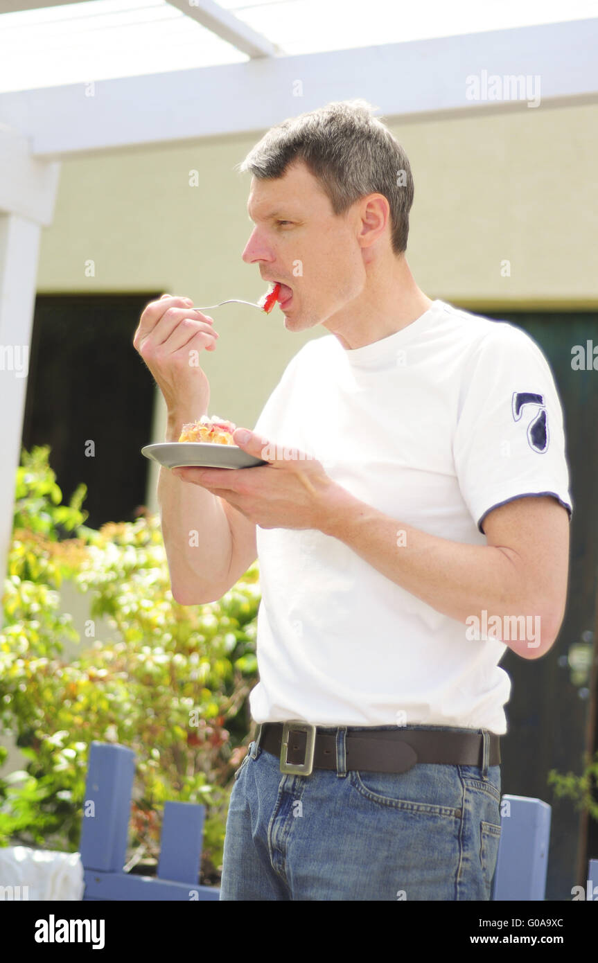 eating strawberry cake Stock Photo - Alamy