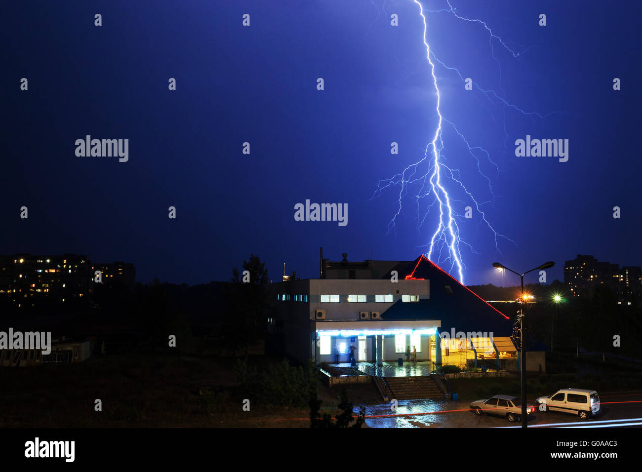 Severe lightning storm with rain over a city buildings at night Stock ...