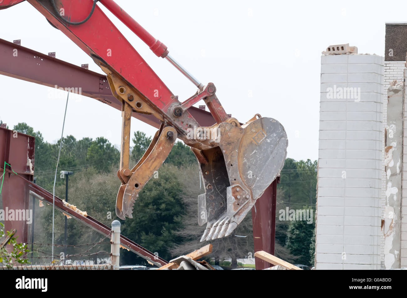 wreck excavator at work demolishing a building wall Stock Photo - Alamy