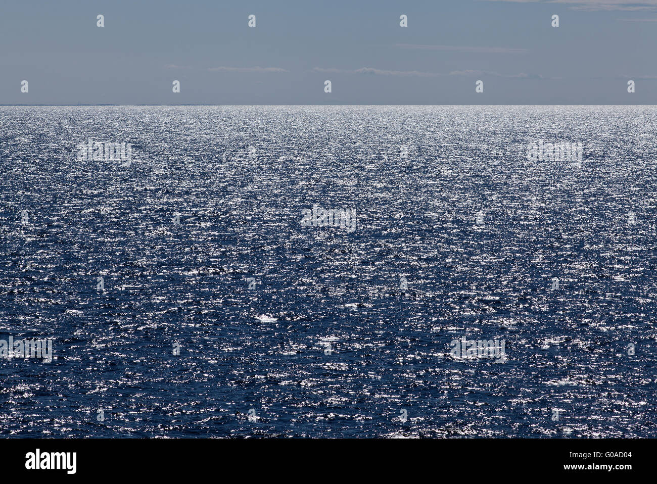 The Sea in back-light. Glittering ocean at sea. Horizon and coastline ...