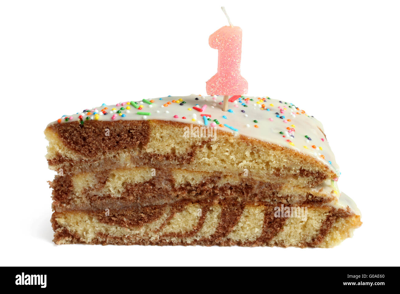 Slice of birthday cake with number one candle Stock Photo - Alamy
