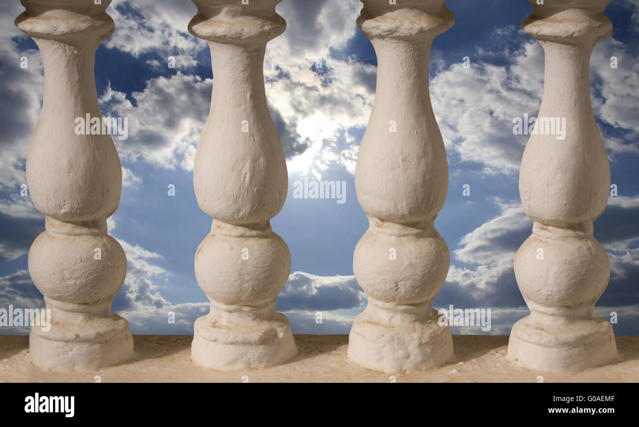 Baluster or little columns and sky behind it Stock Photo - Alamy