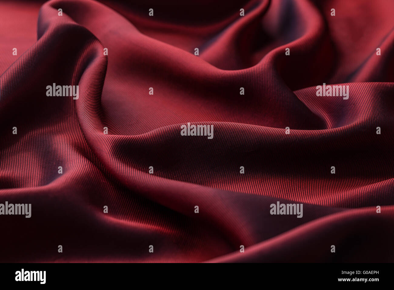 Red texture, wavy glossy silk drapery Stock Photo - Alamy