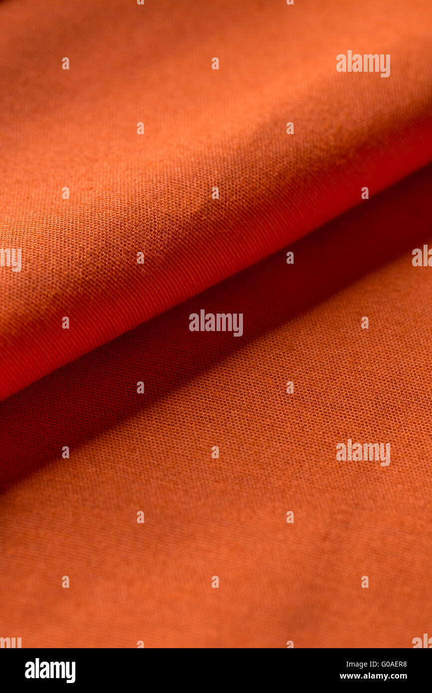 Closeup detail of orange fabric texture Stock Photo - Alamy