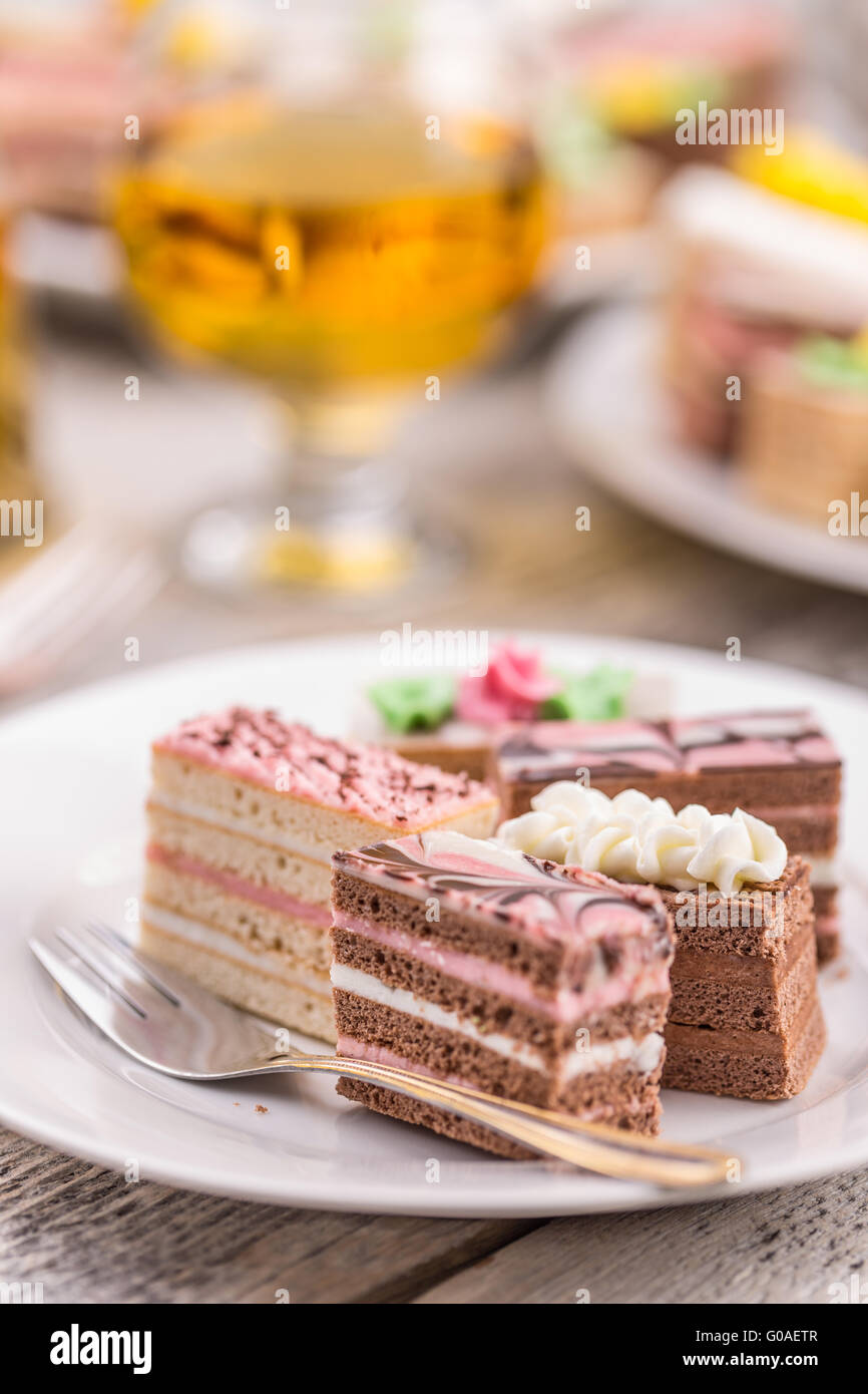 Small cakes with different cream Stock Photo - Alamy