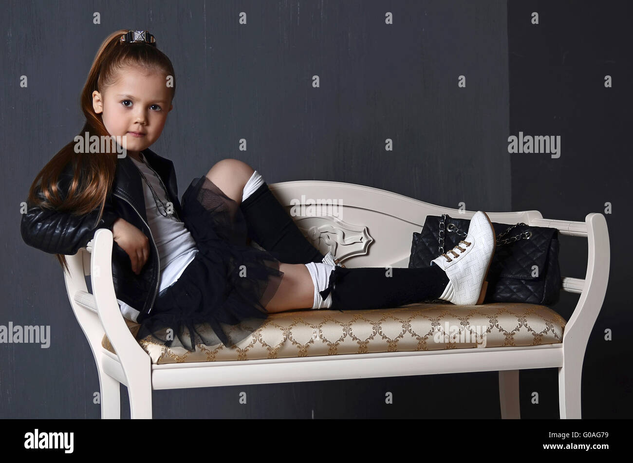 beautiful young female child model wearing a black Stock Photo - Alamy