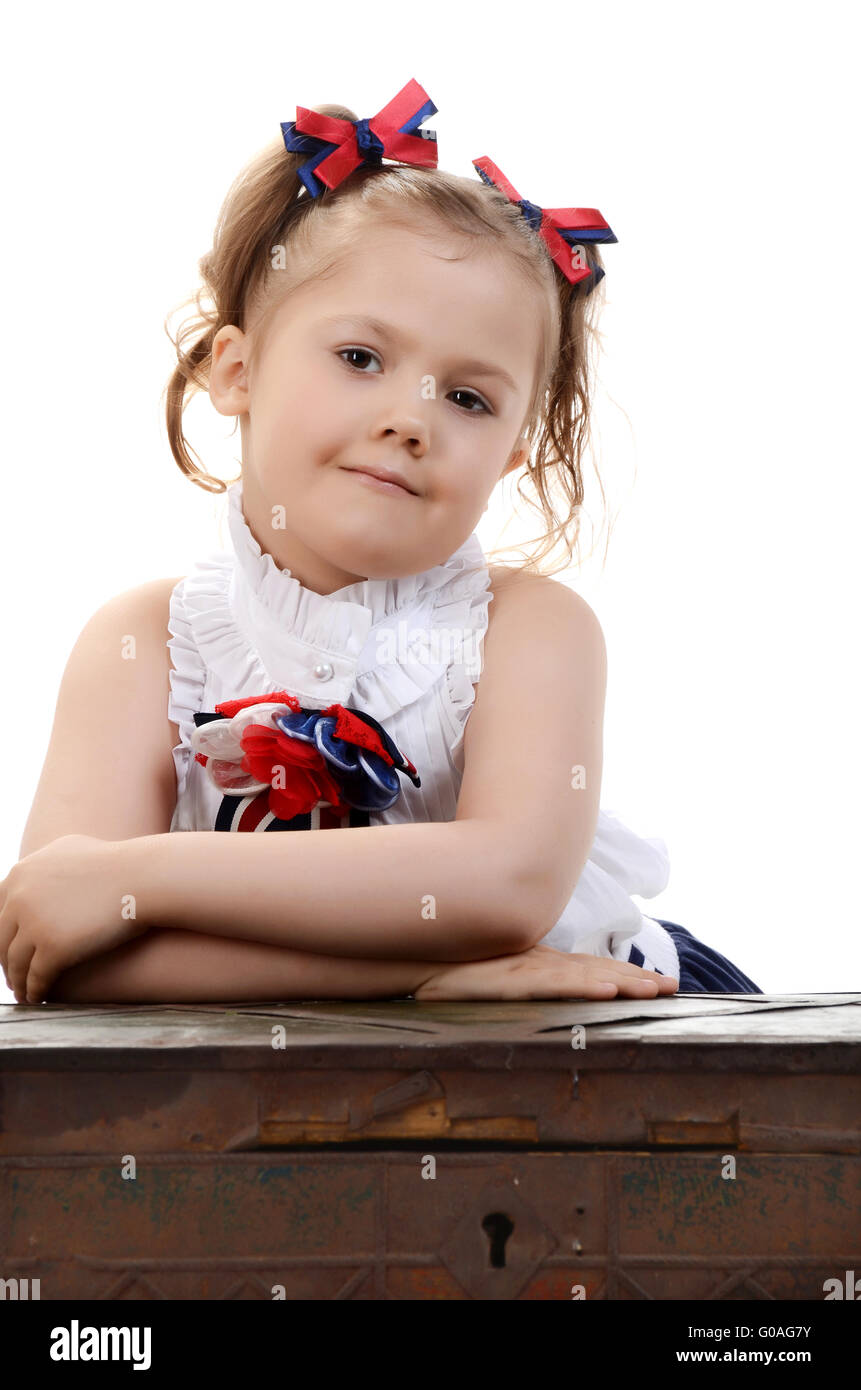 beautiful young female child model sitting on a chest Stock Photo - Alamy